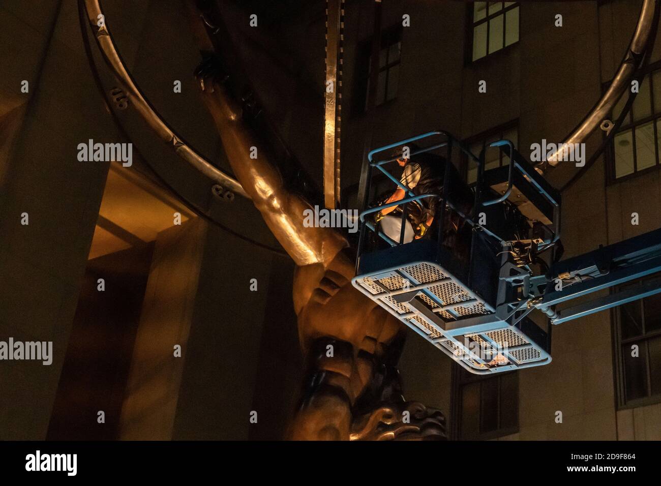 NEW YORK, NY - NOVEMBER 04, 2020: A worker attaches facial mask for the ...