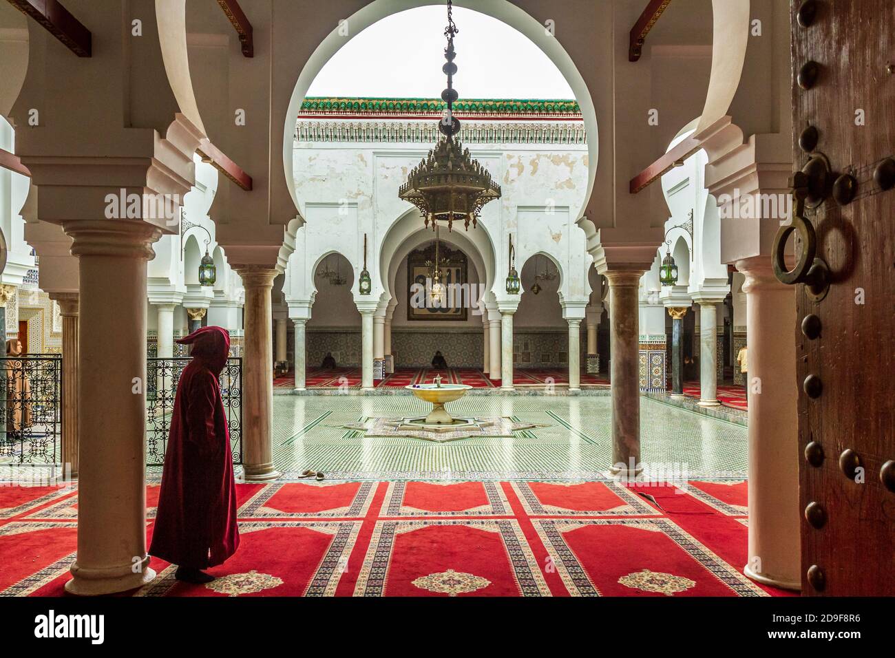 Moroccan in the courtyard of a Moroccan mosque Stock Photo - Alamy