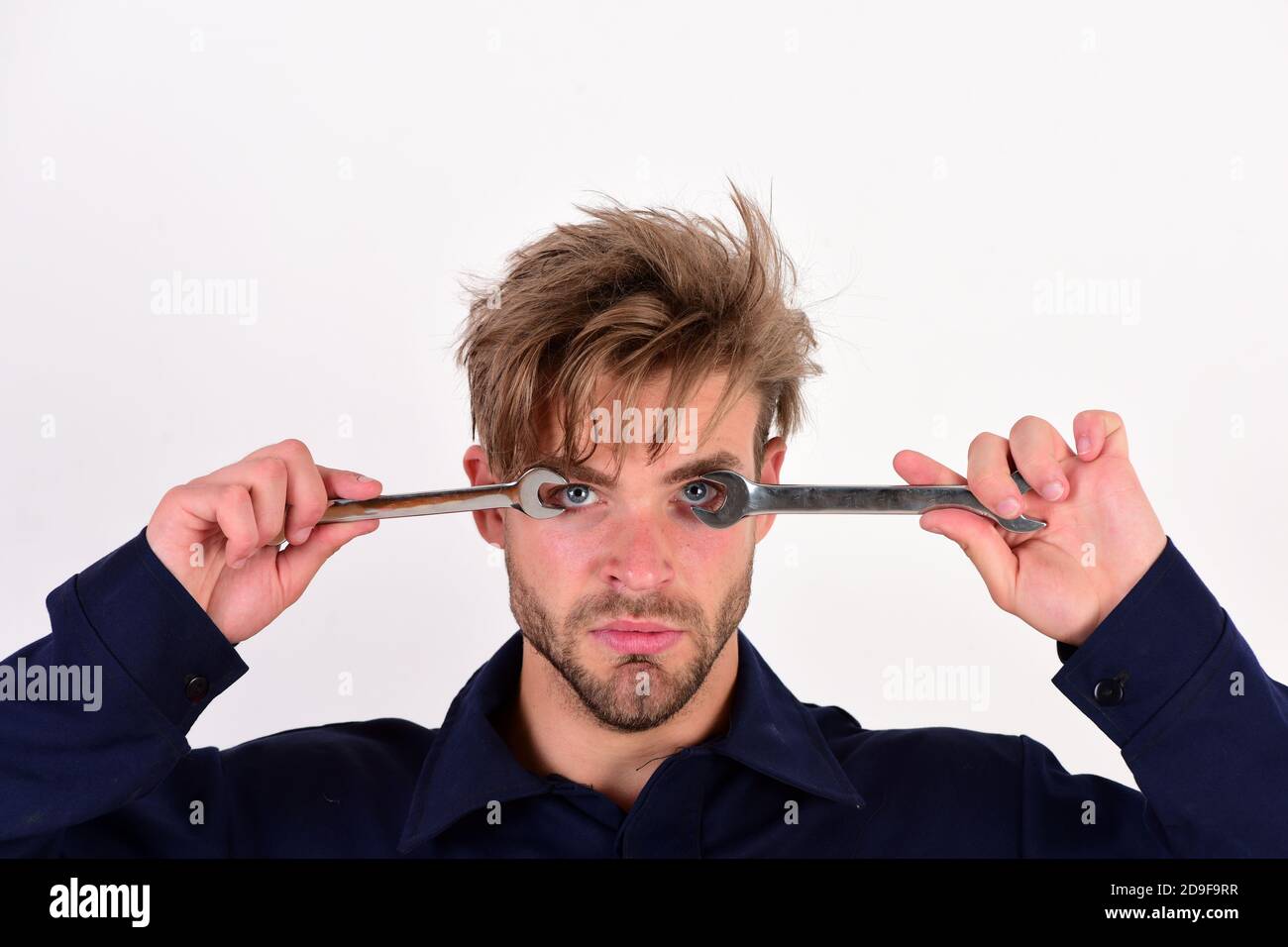 Service and engineering concept. Mechanic or plumber with spanners in ...