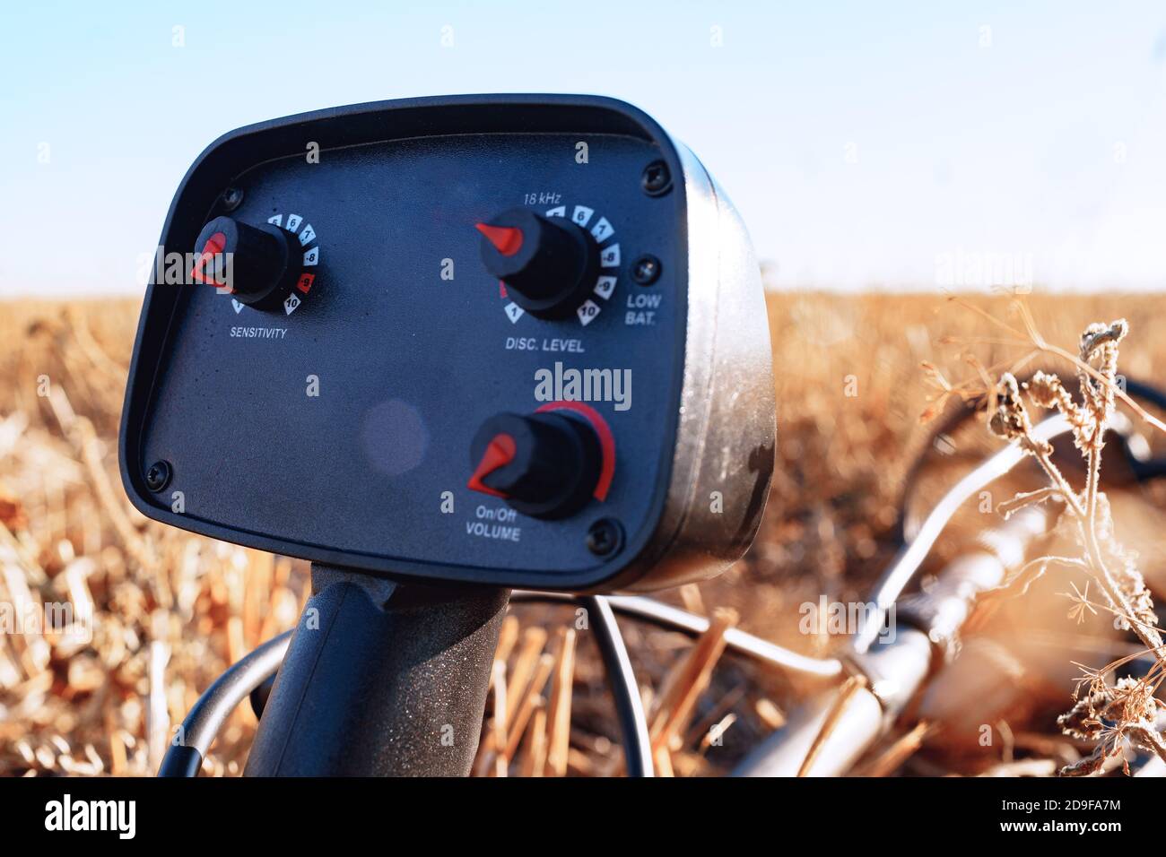Metal detector device lying on the ground Stock Photo - Alamy