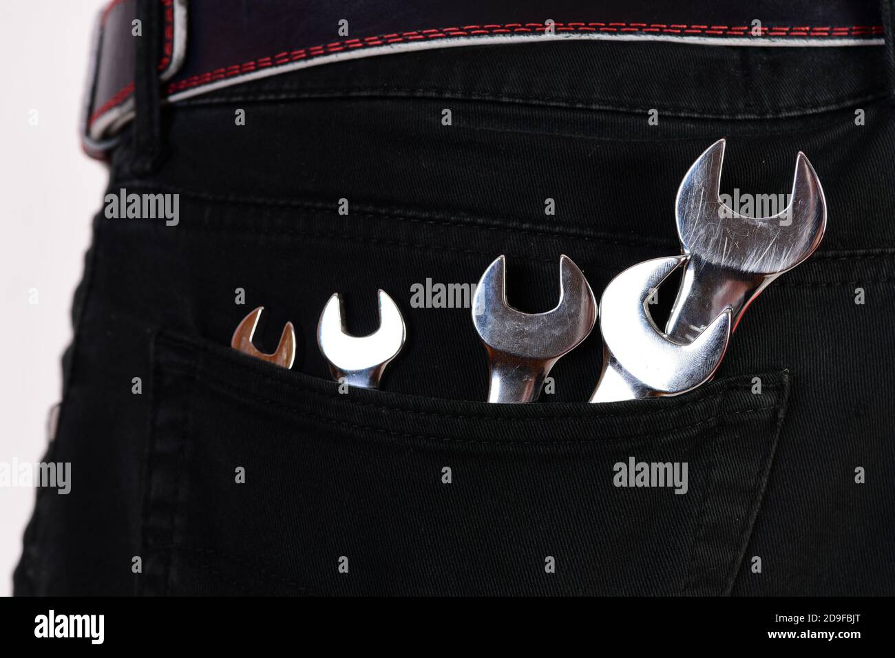 Spanner equipment made of metal. Repairer or mechanic costume with ...