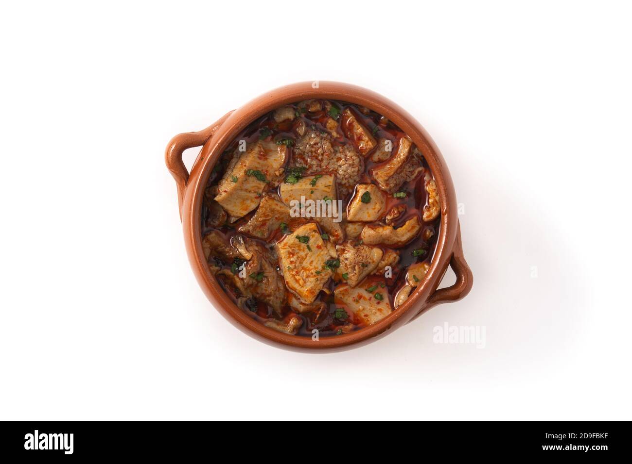 Traditional mondongo or el menudo soup isolated on white background ...