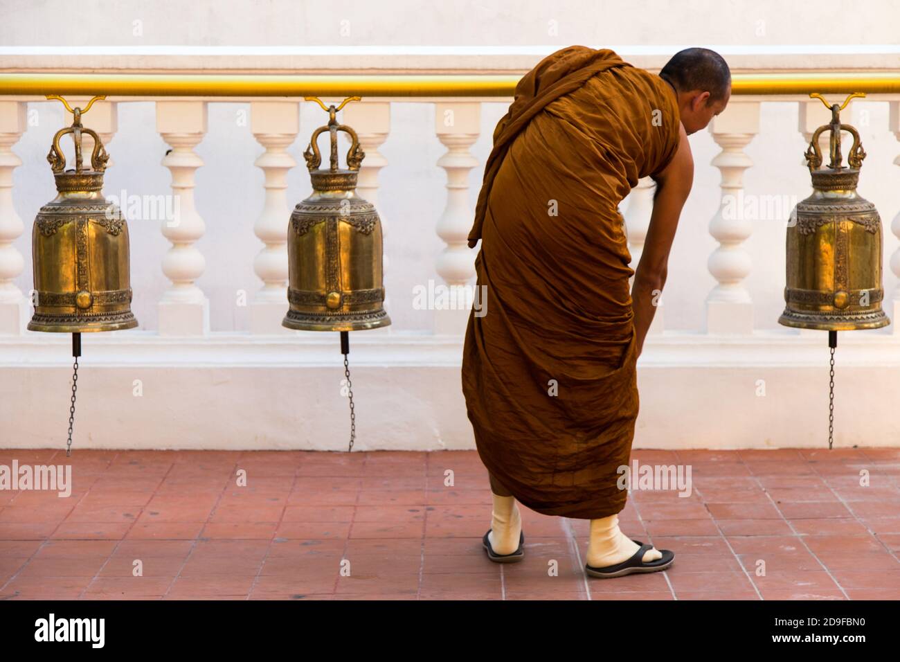 Buddhist monk ringing bells hi-res stock photography and images - Alamy