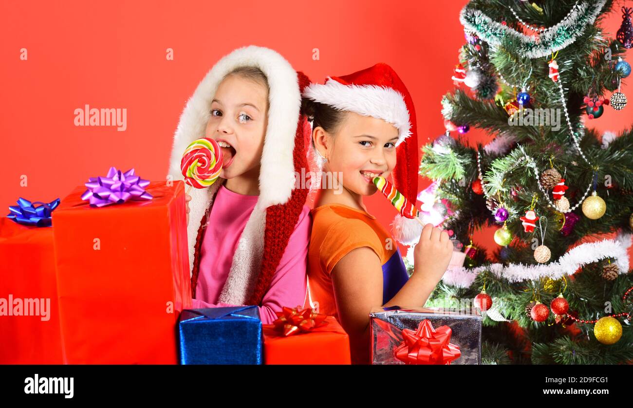 Girls celebrate Christmas together. Children with smiling faces stand ...