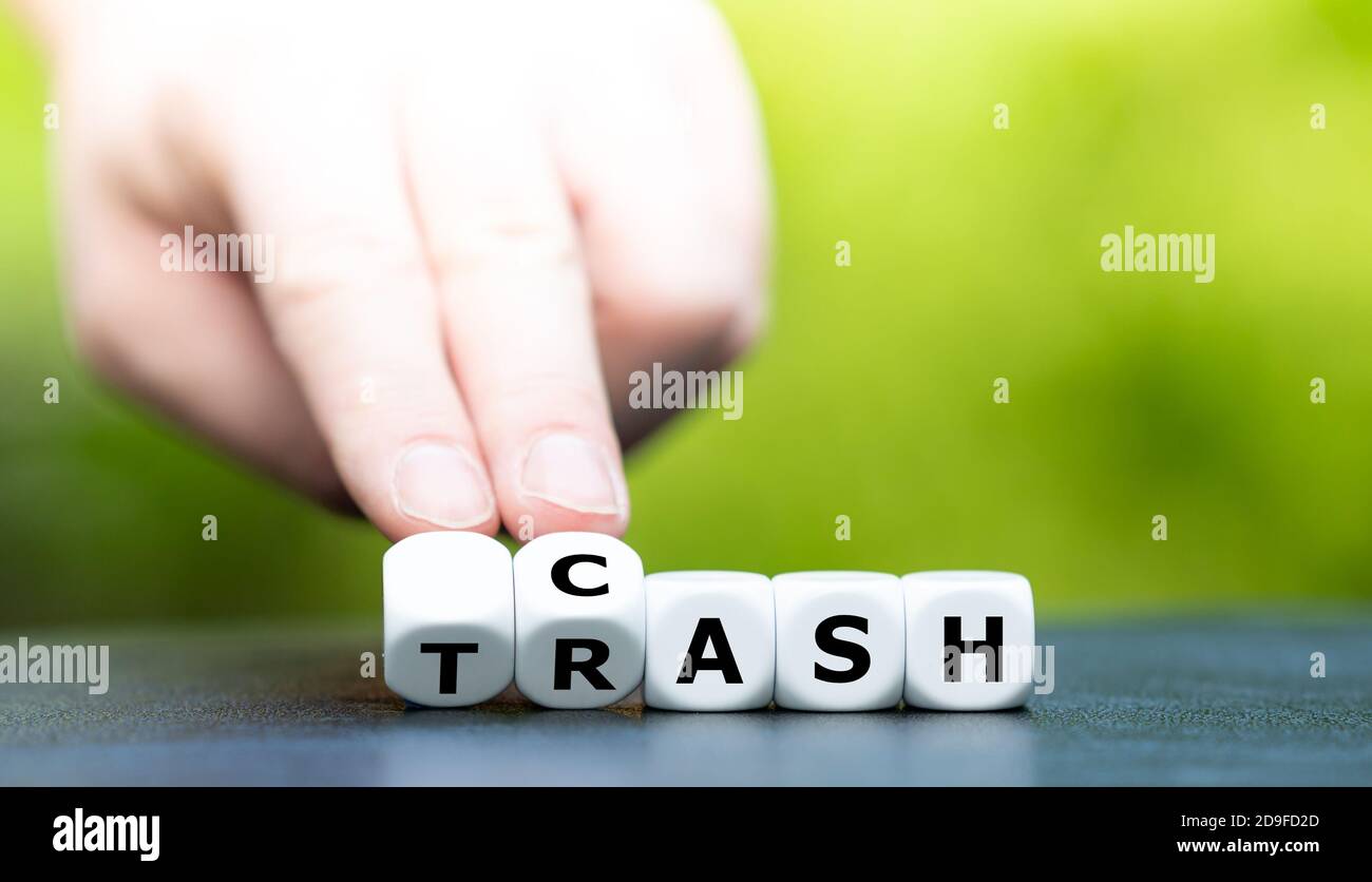 From trash to cash. Hand turns dice and changes the word "trash" to ...