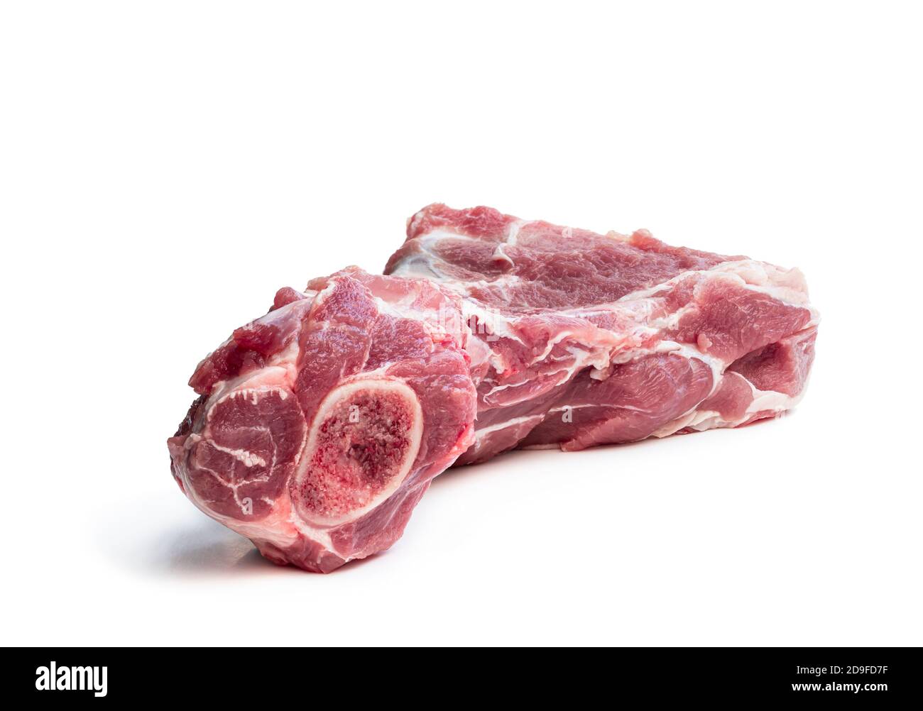 Raw lamb bone isolated on white background Stock Photo - Alamy