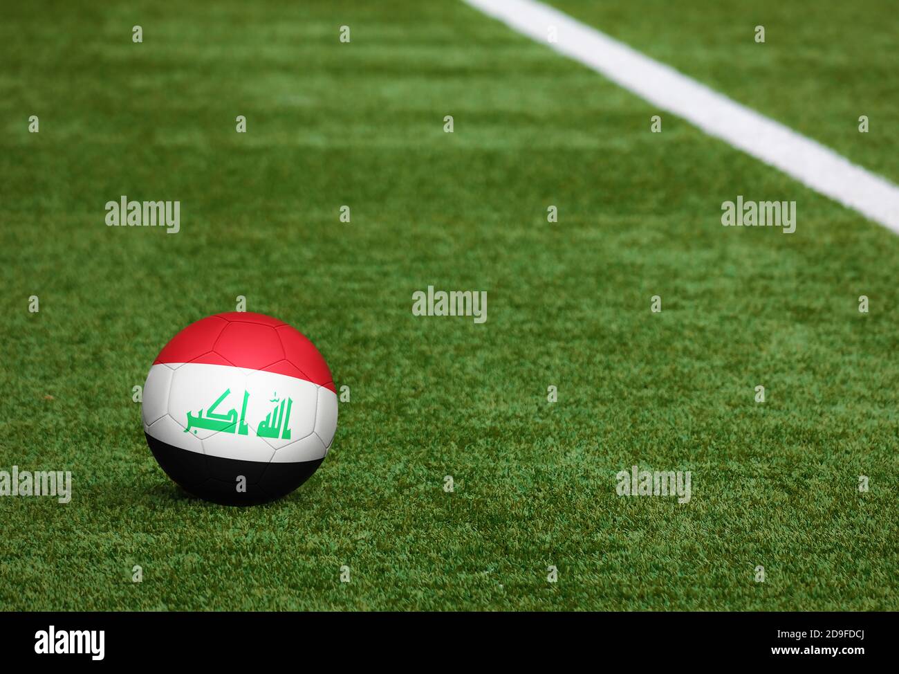 Iraq flag on ball at soccer field background. National football theme ...