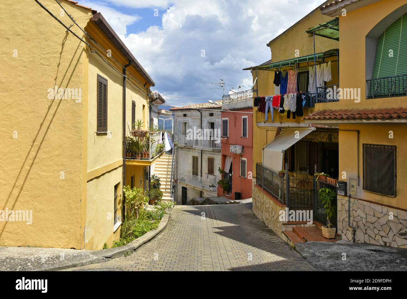 A narrow street among the old houses of Santa Maria del Cedro, a rural ...