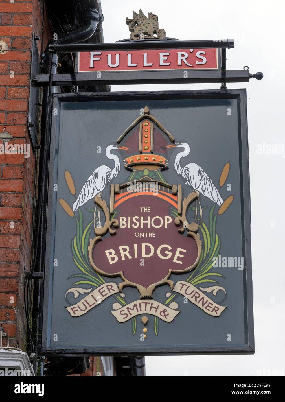 Traditional hanging pub sign at The Bishop on the Bridge public house a ...