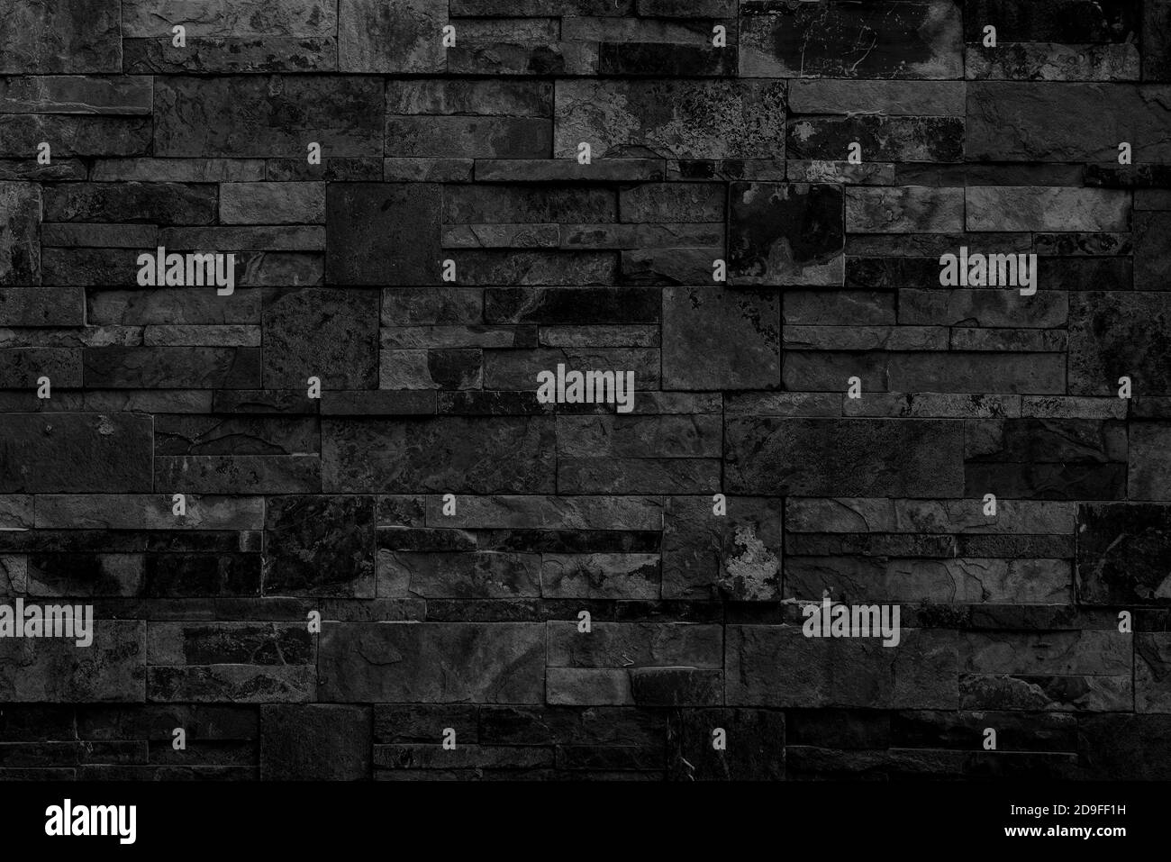 Black brick building wall. Interior of a modern loft. Background for ...