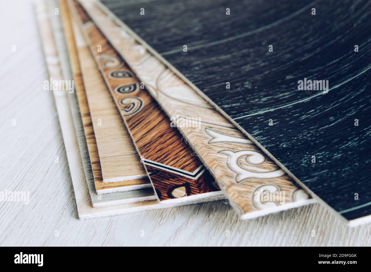 Linoleum cut into pieces. Samples of flooring in a bundle Stock Photo ...