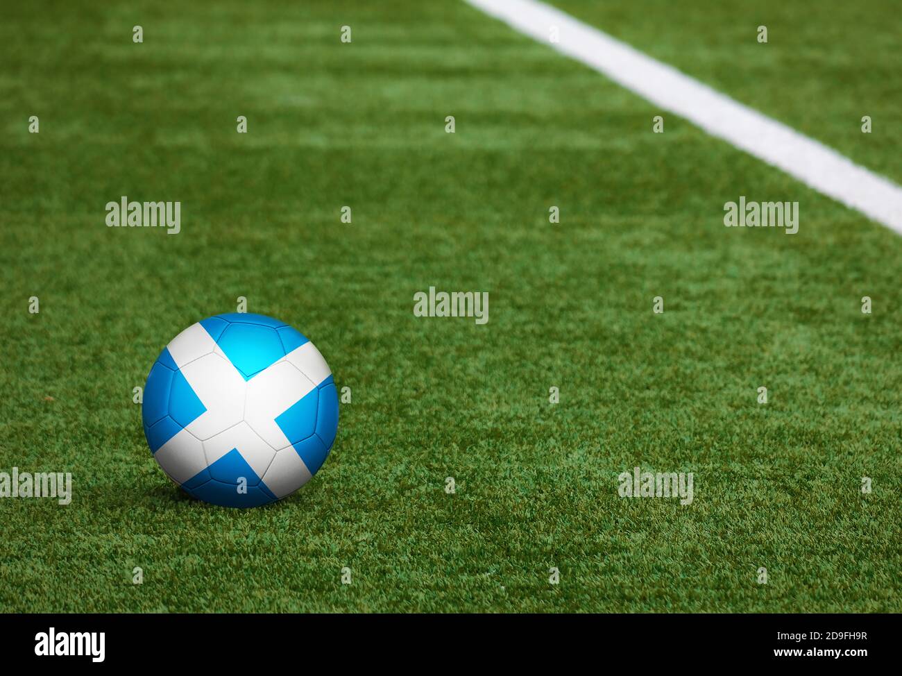 Scotland flag on ball at soccer field background. National football ...