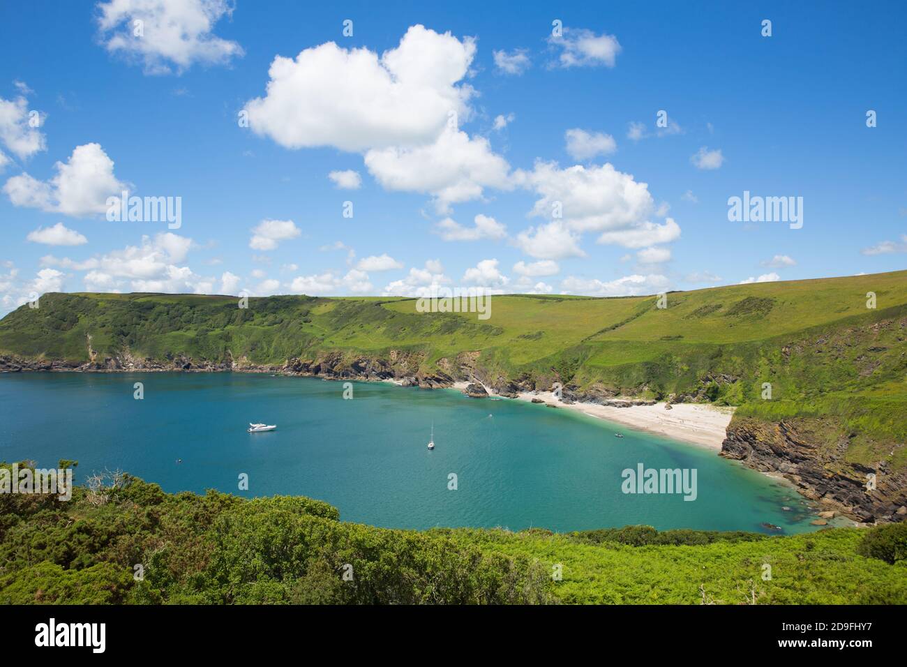 Secluded beach Lantic Bay Cornwall with turquoise blue sea on a ...