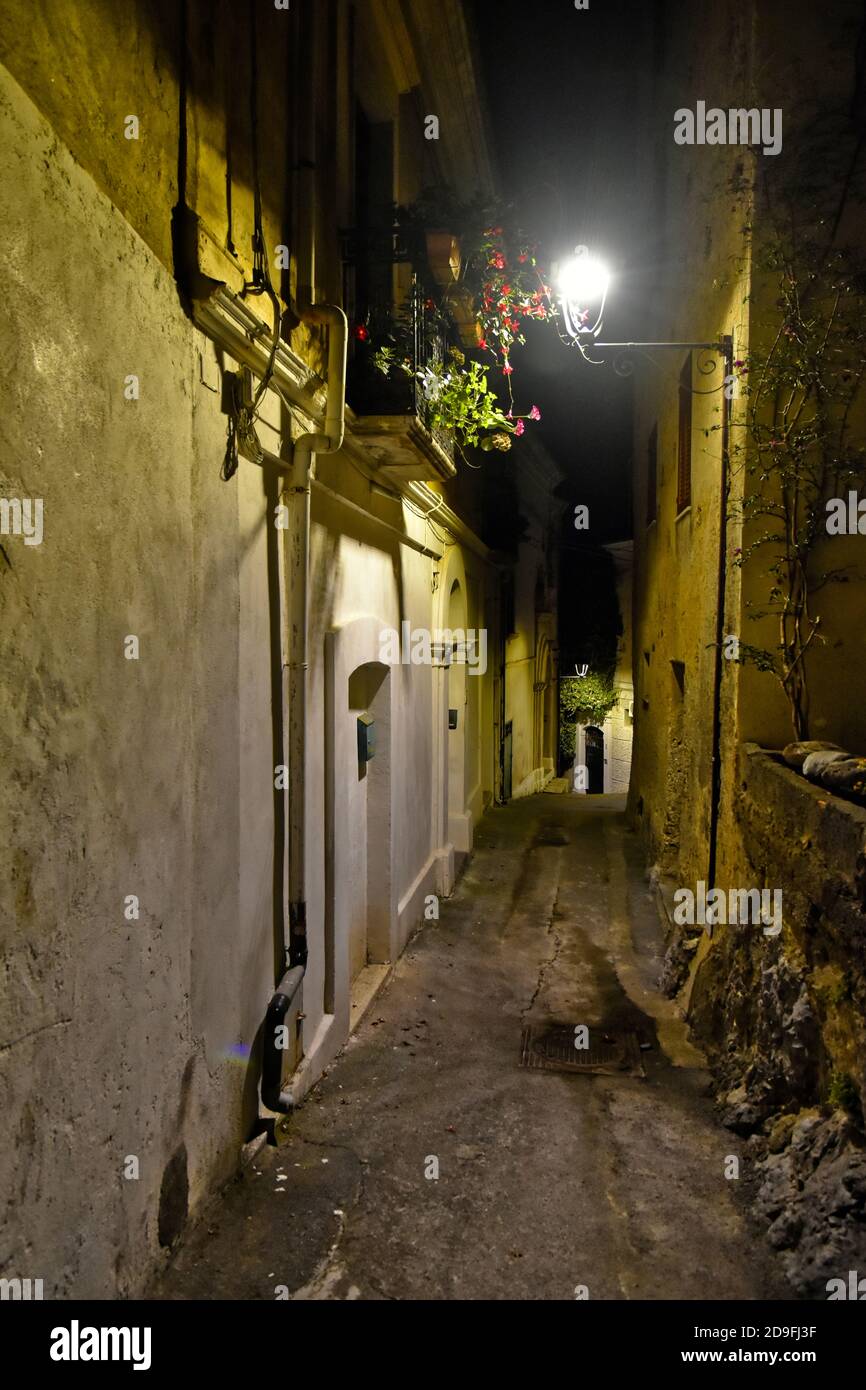 A narrow street among the old houses of San Nicola Arcella, a rural ...