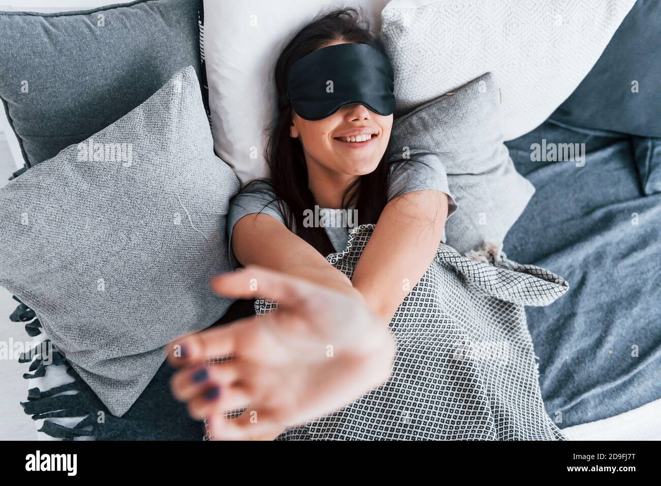 Young beautiful woman in lying down on bed at home alone and sleeping ...