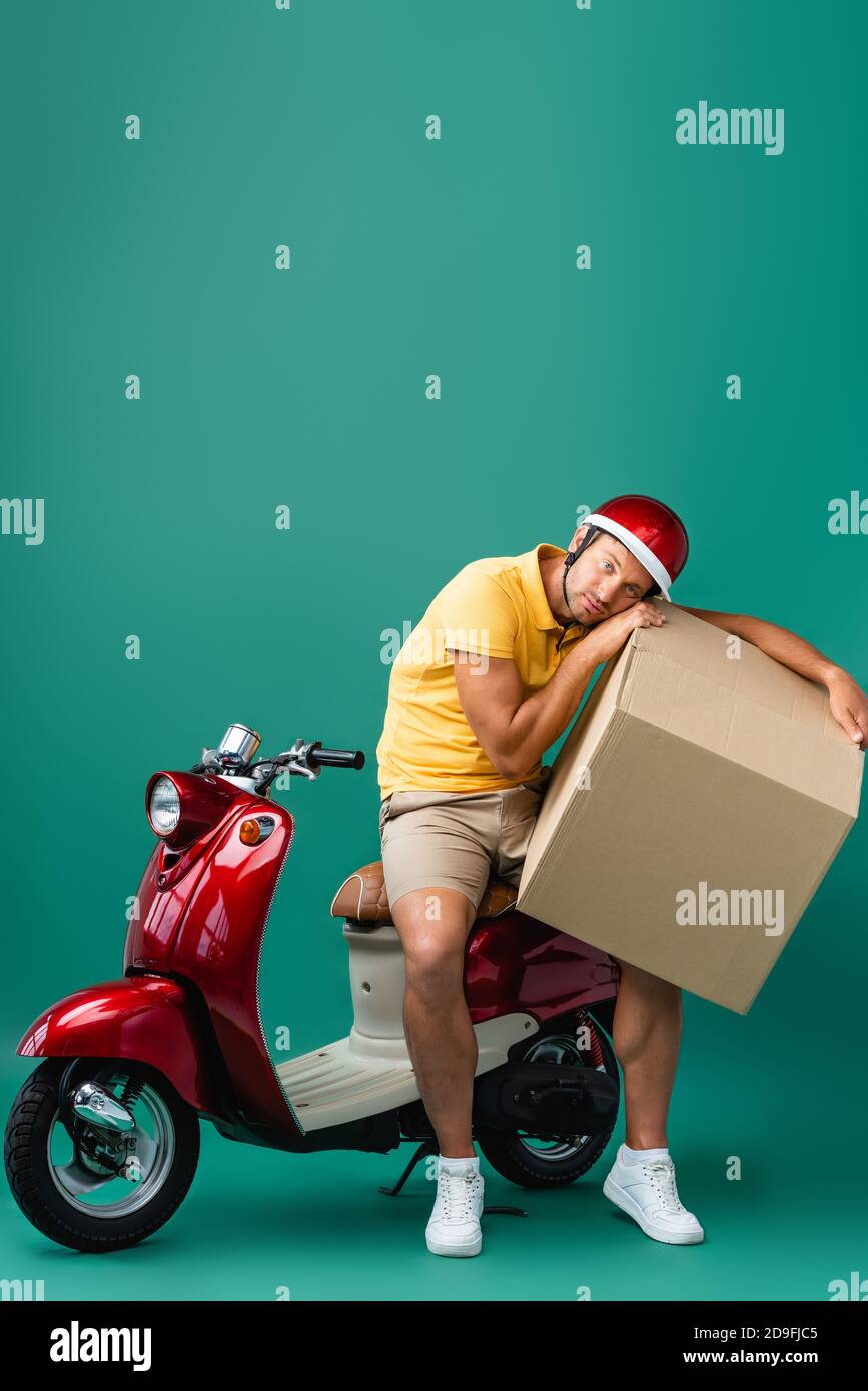 Tired delivery man box hi-res stock photography and images - Alamy