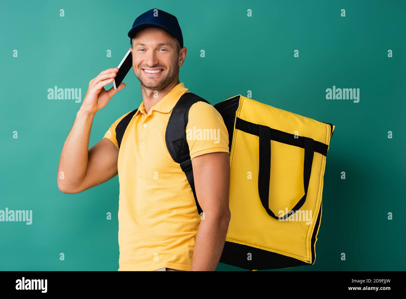 Delivery man with yellow backpack hi-res stock photography and images ...