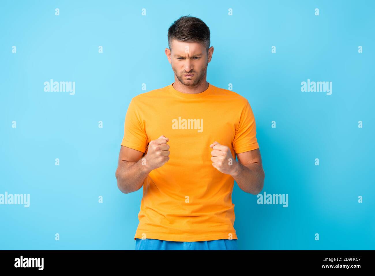 Angry man clenched fists hi-res stock photography and images - Alamy