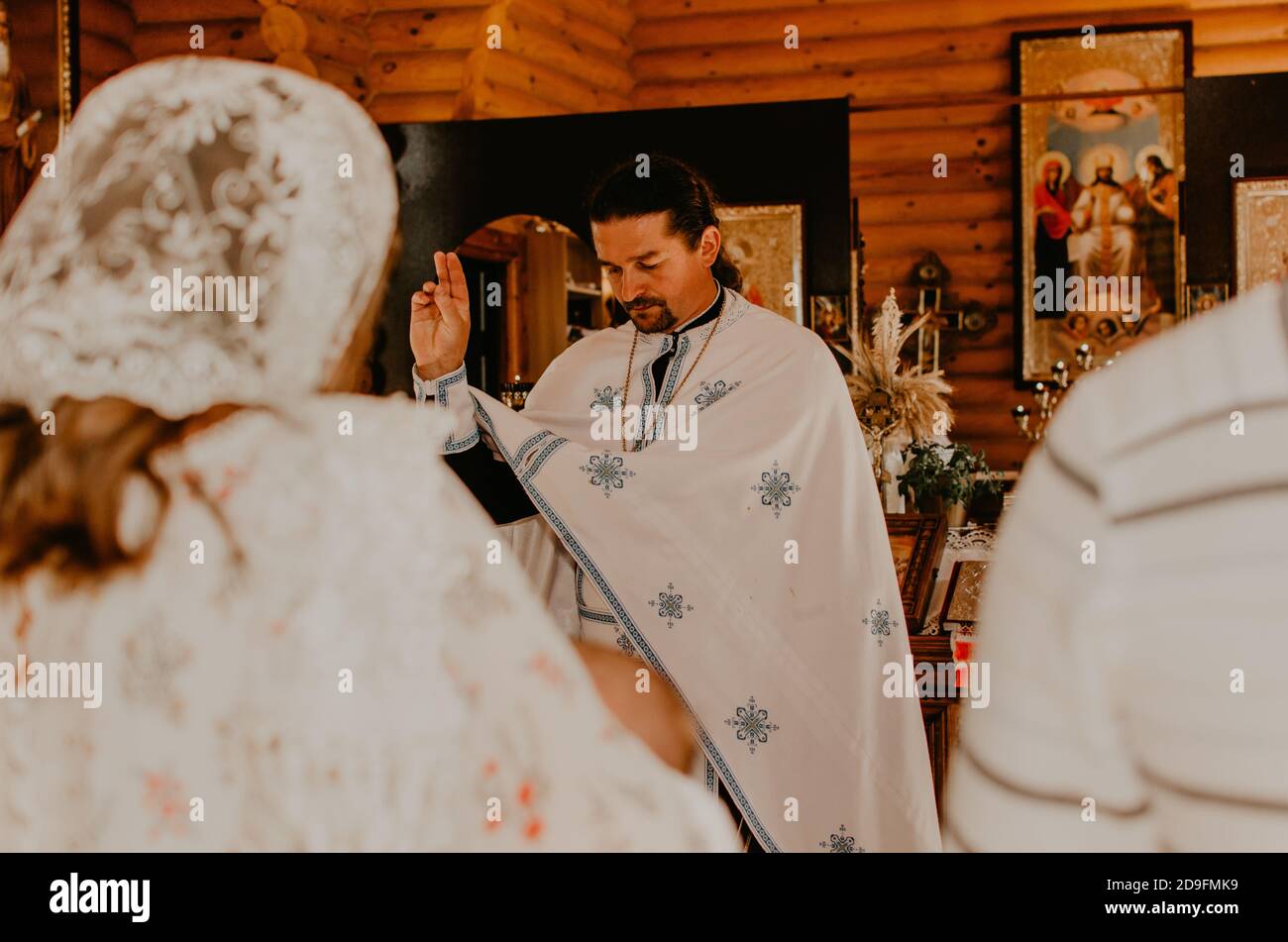 Baptism ceremony godparents hi-res stock photography and images - Alamy