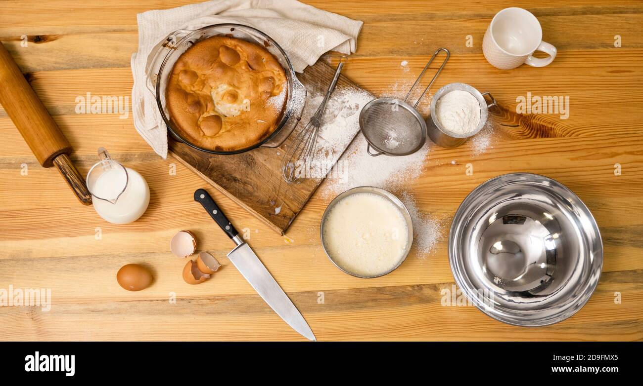 Tasty apple pie on a oaken wood table with a ingredients. Cooking a ...