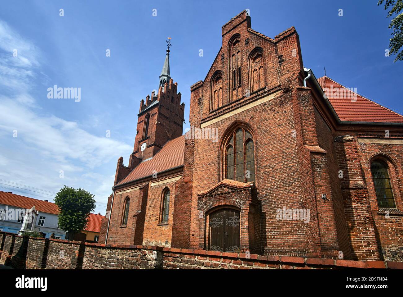 historic, gothic red brick church with a belfry in the village of ...
