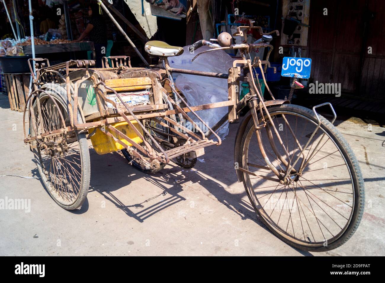 old tricycle standing in sun Stock Photo - Alamy
