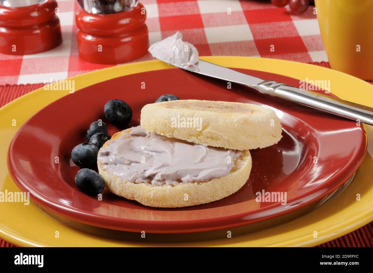 A toasted blueberry muffin with blueberry cream cheese Stock Photo - Alamy