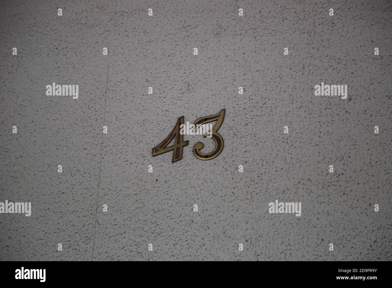 Closeup shot of number forty-three on a wall of the house Stock Photo ...