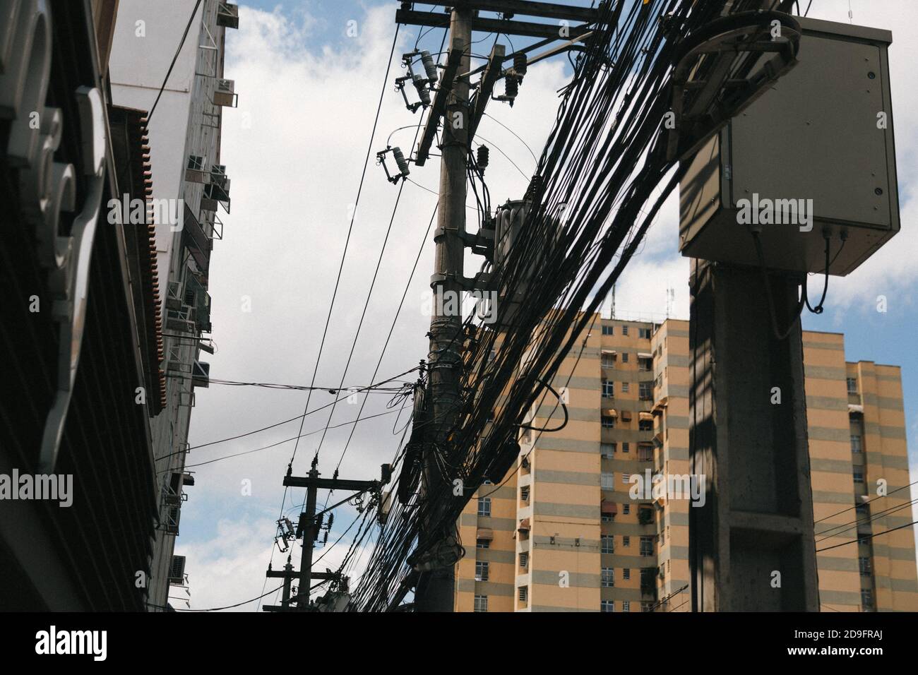 Low angle shot of a power pole with electricity cables Stock Photo - Alamy