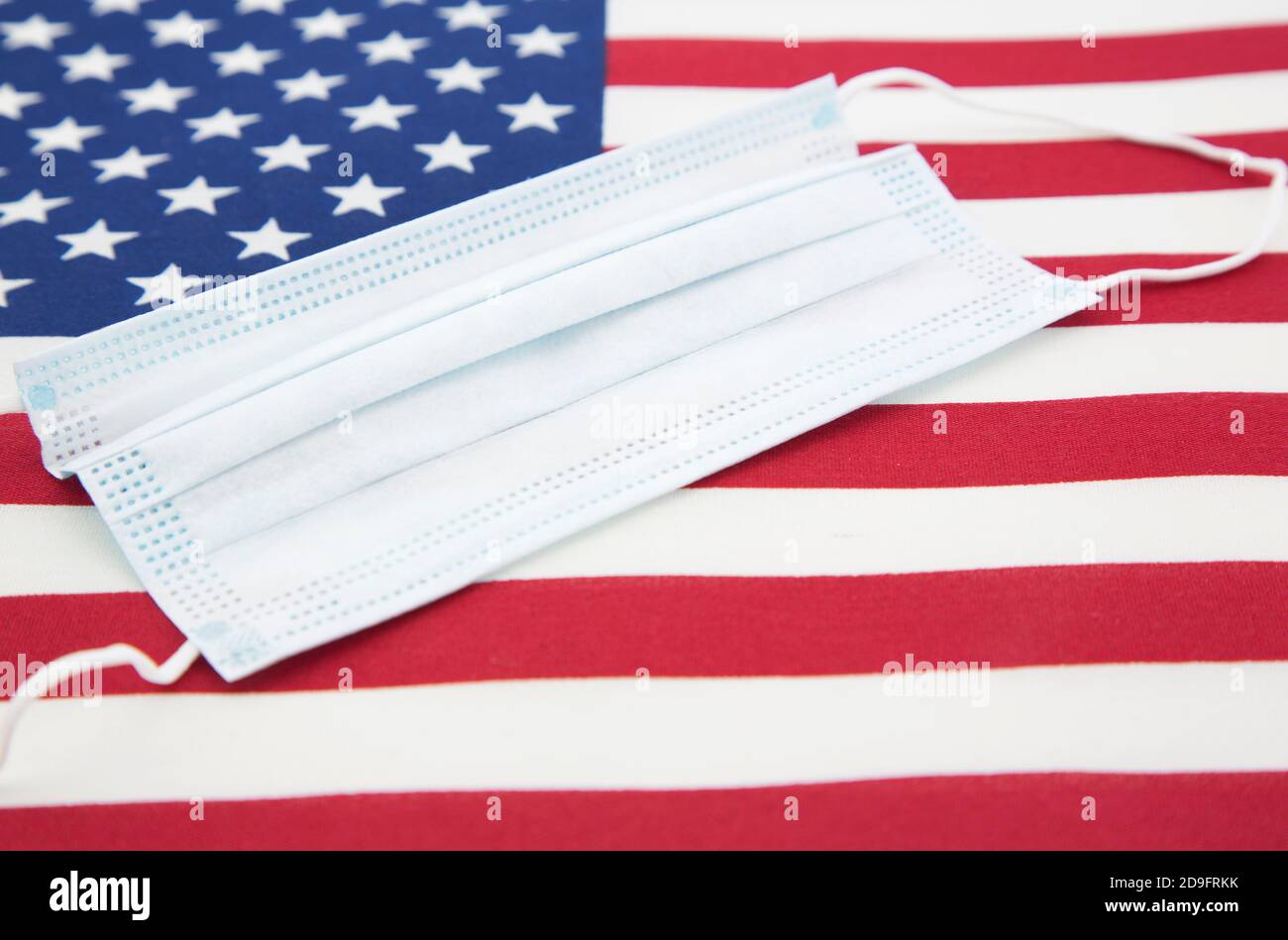 Medical mask placed on American flag reflects Covid 19 mandates and ...