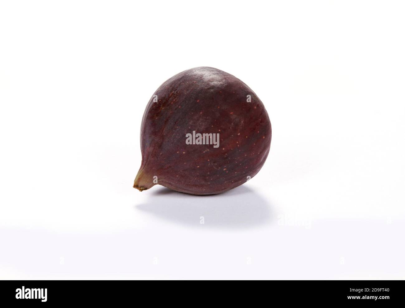 Single juicy whole fig isolated on a white background Stock Photo - Alamy