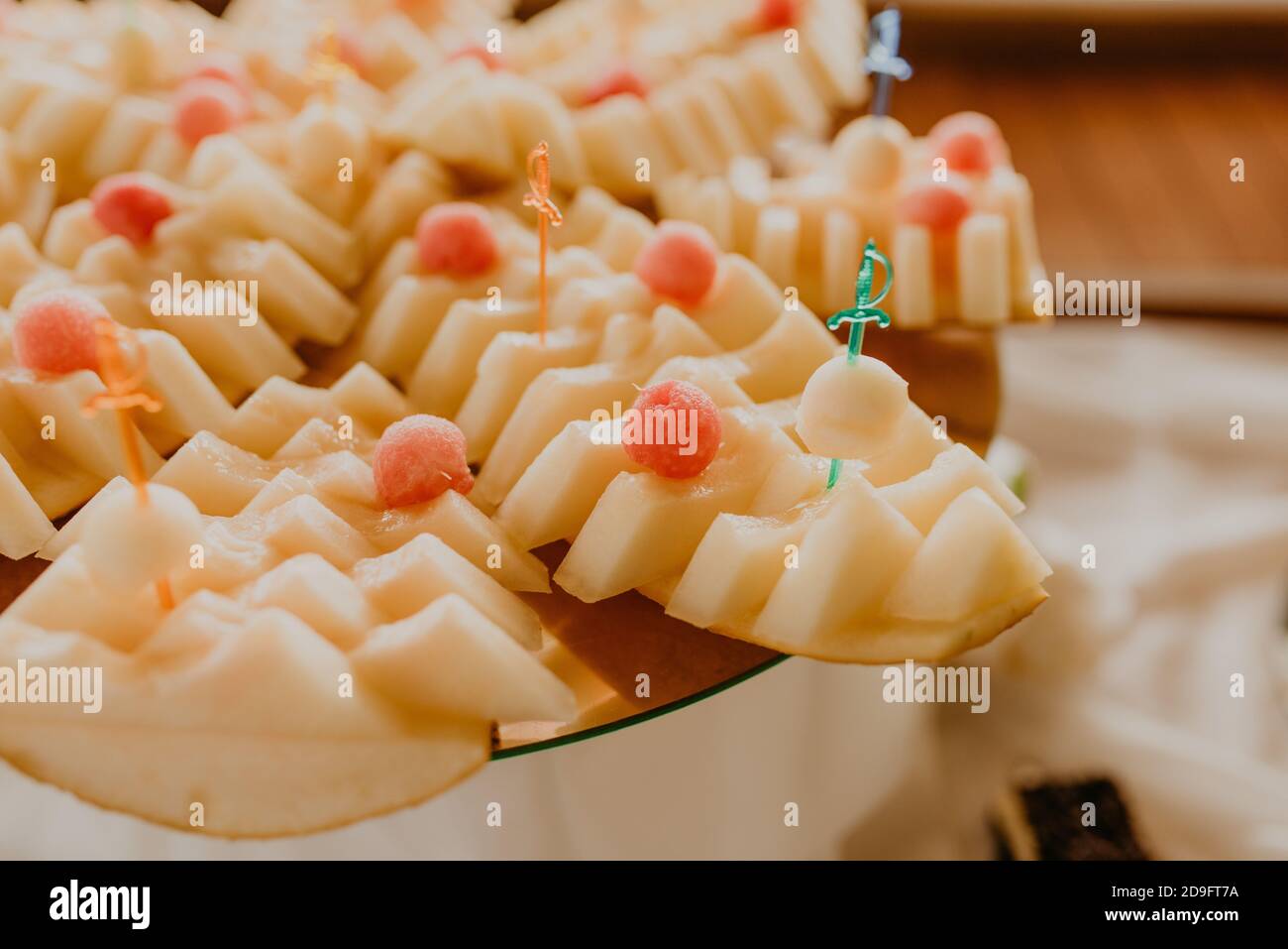 sliced fresh melon on a plate for a buffet table Stock Photo - Alamy