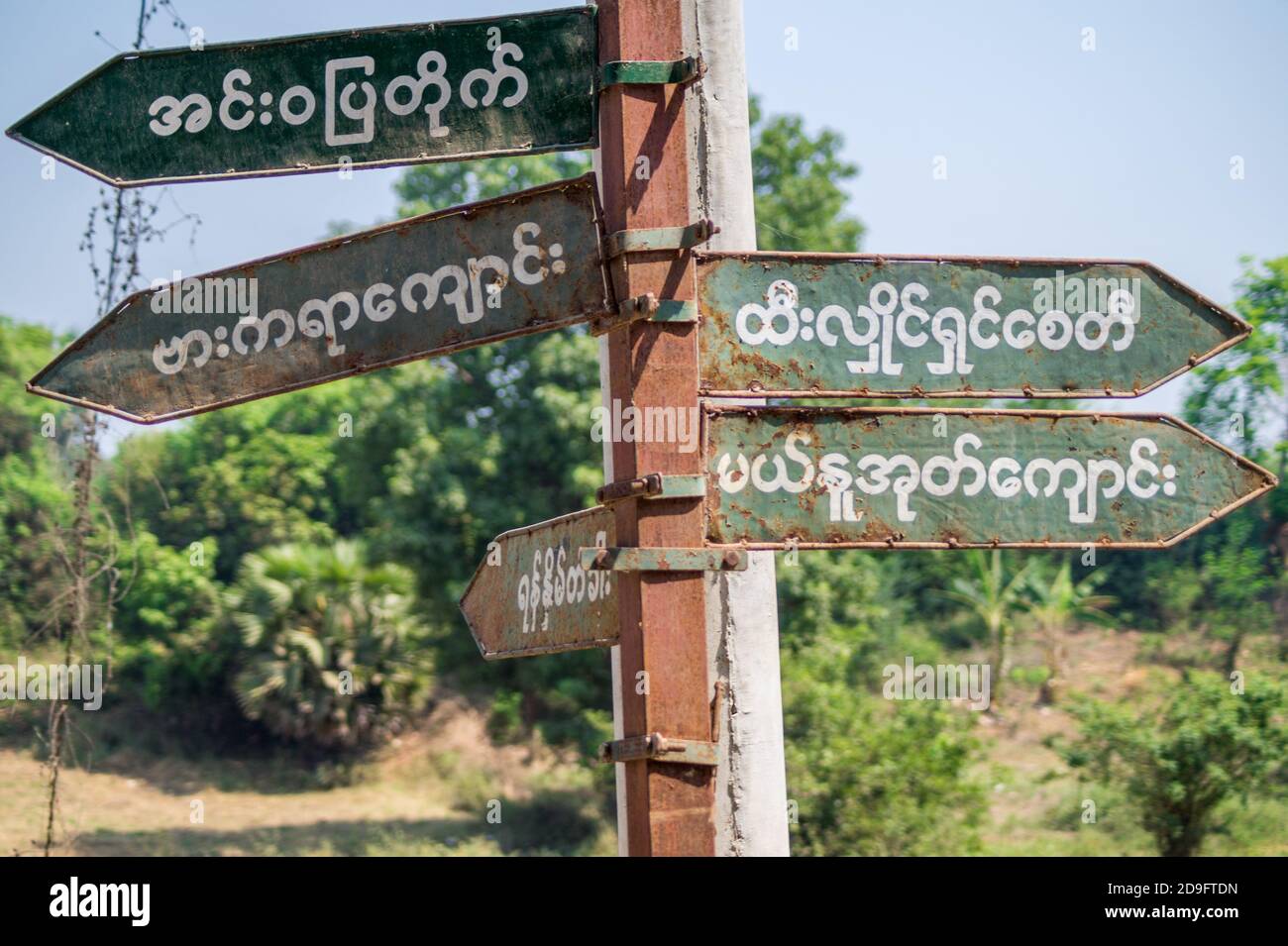 sign with foreign letters in myanmar Stock Photo - Alamy