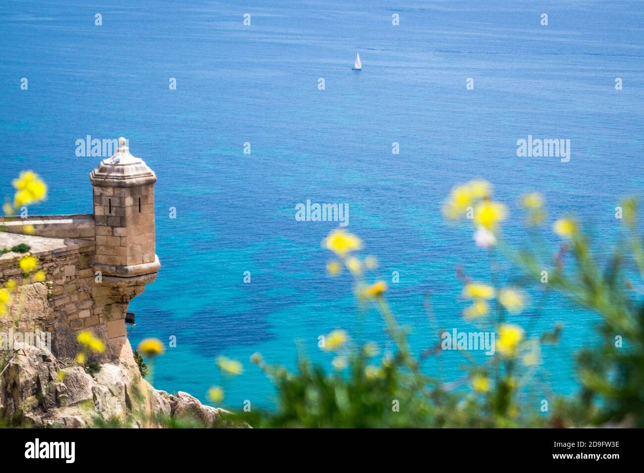 Sea view with castle tower Stock Photo - Alamy