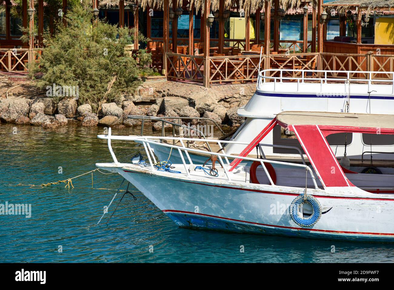 Old sea yachts stand on the seashore Stock Photo - Alamy