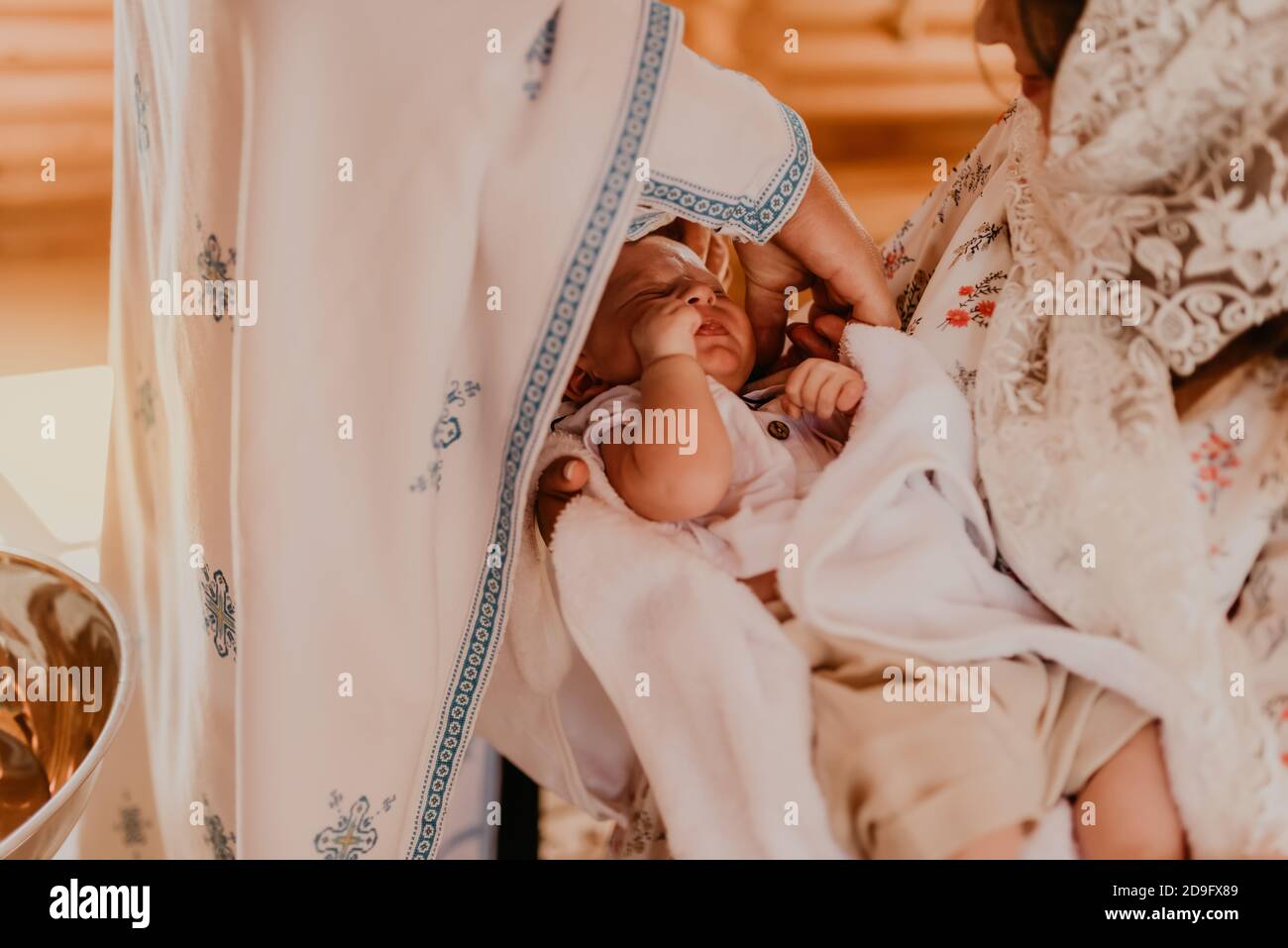 rite of sacrament of epiphany child baby in church Stock Photo - Alamy