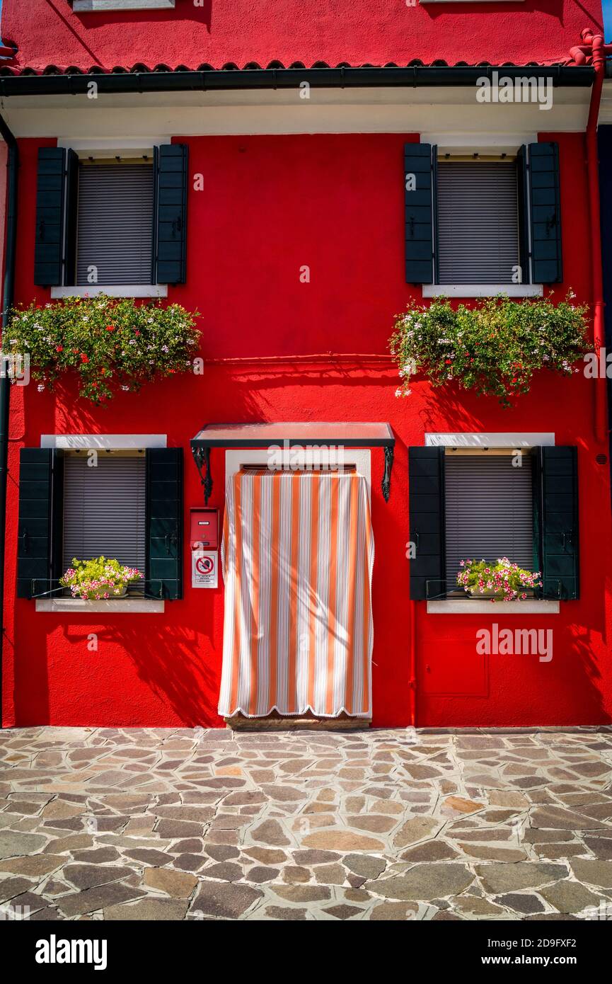 House with a red facade Stock Photo - Alamy