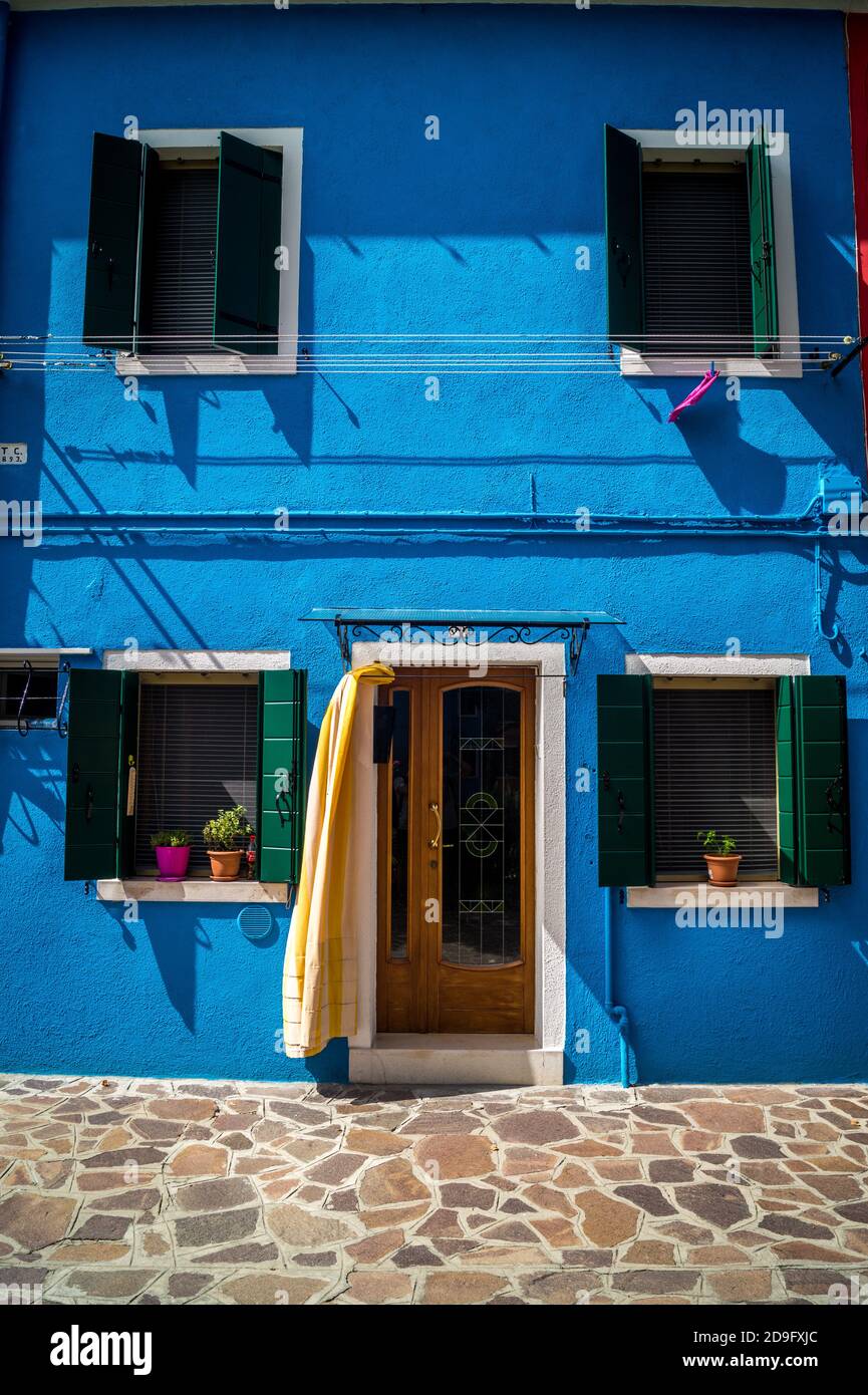 House with a blue facade Stock Photo - Alamy