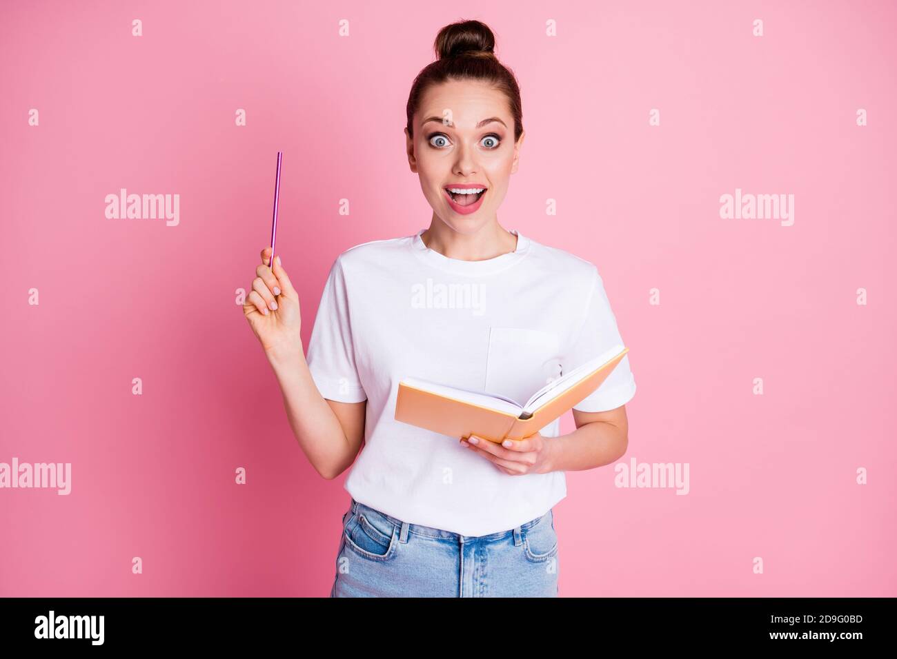 Photo of astonished positive girl write copybook think thoughts get ...