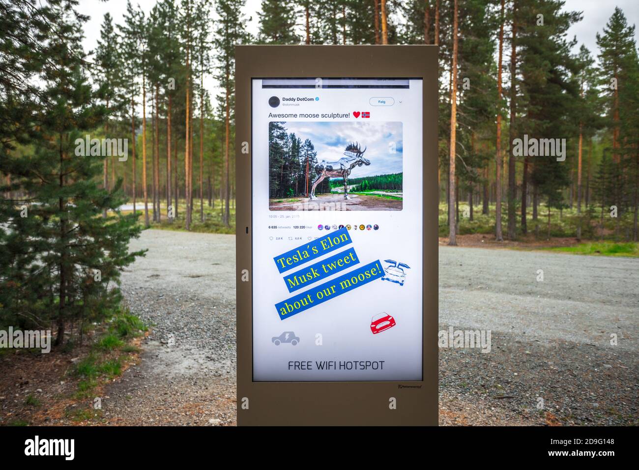 Touristic info board at The Big Silver Moose sculpture with a statement ...
