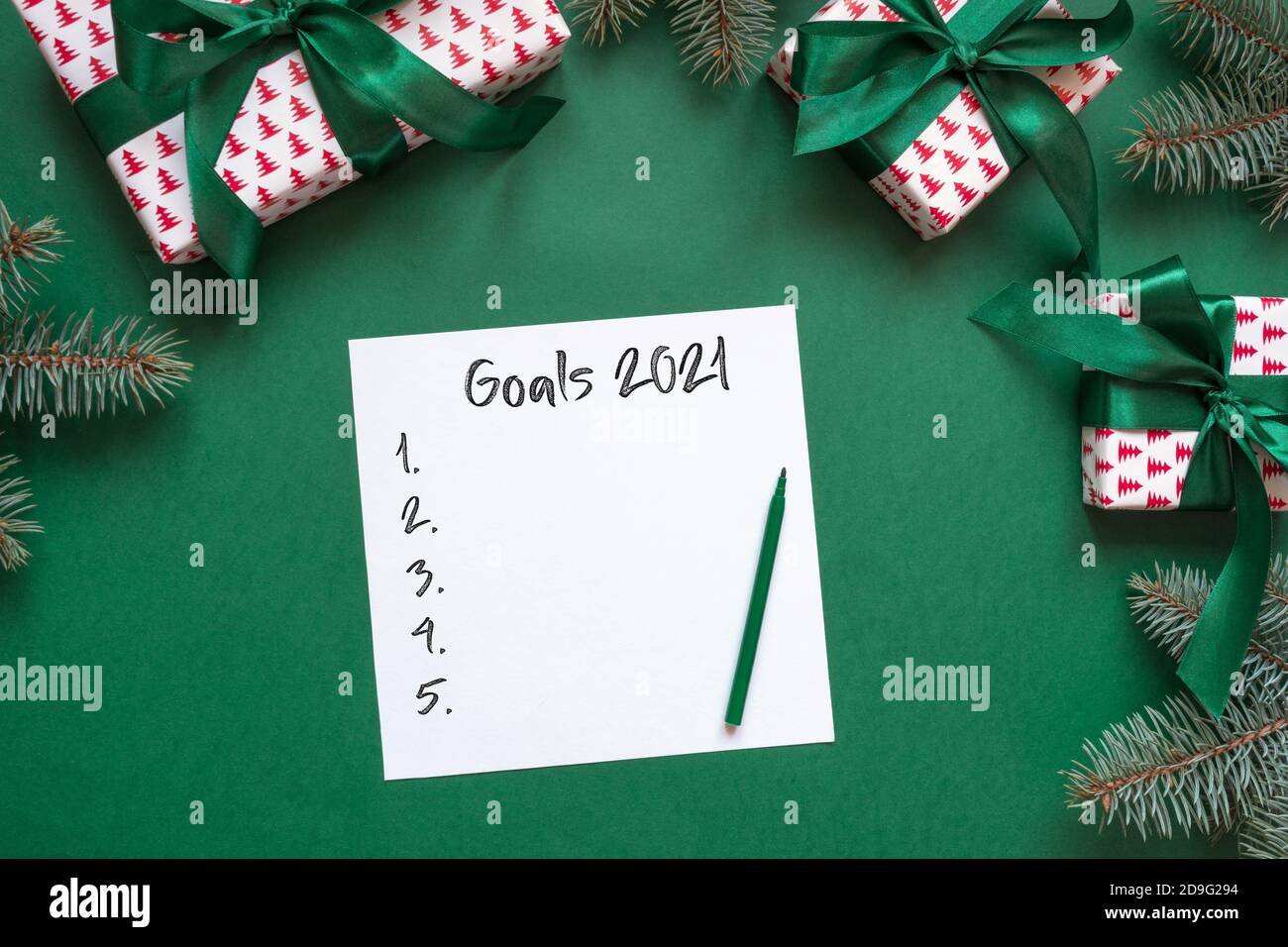 Goals for New 2021 Year and gifts on green. Top view. Vertical format ...