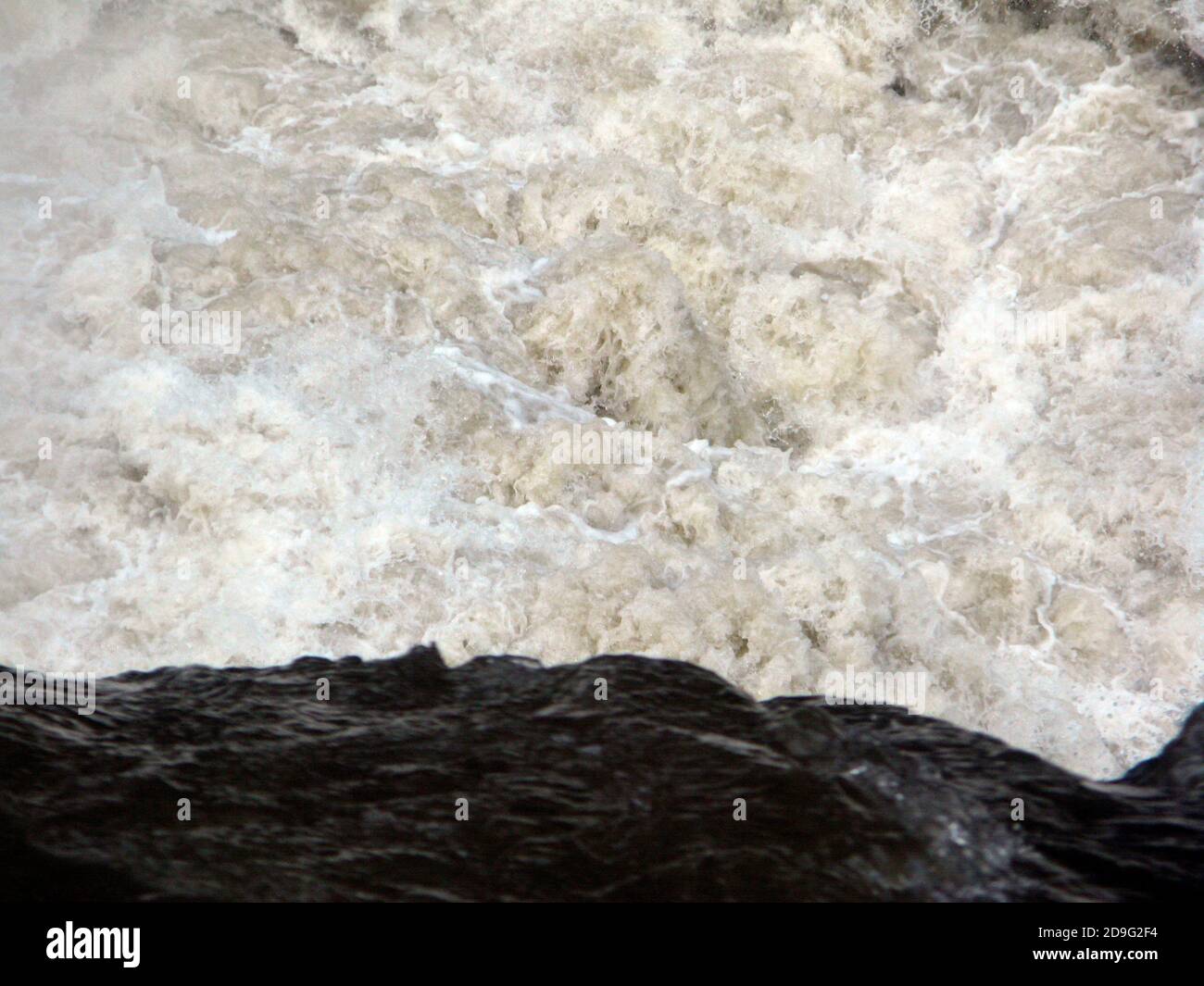 bubbling water in a river, with unsteady muddy brown water Stock Photo ...