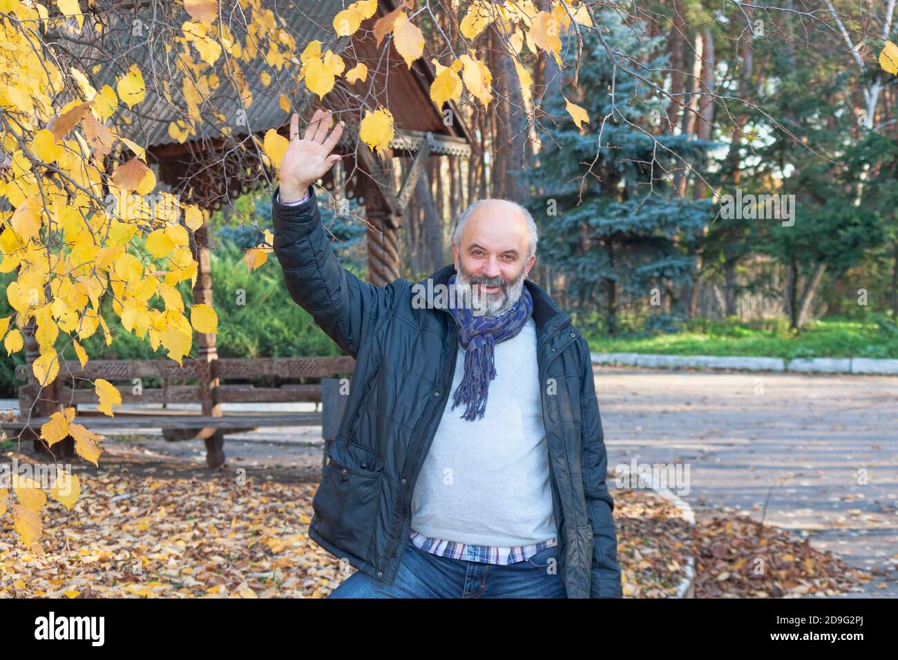 Mature man with a beard in the autumn park. Warm weather - jacket ...