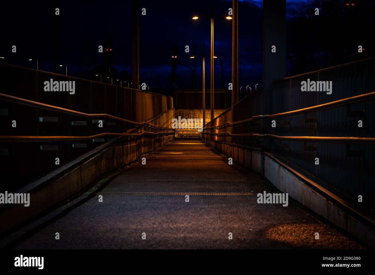 dark way leading down to light Stock Photo - Alamy