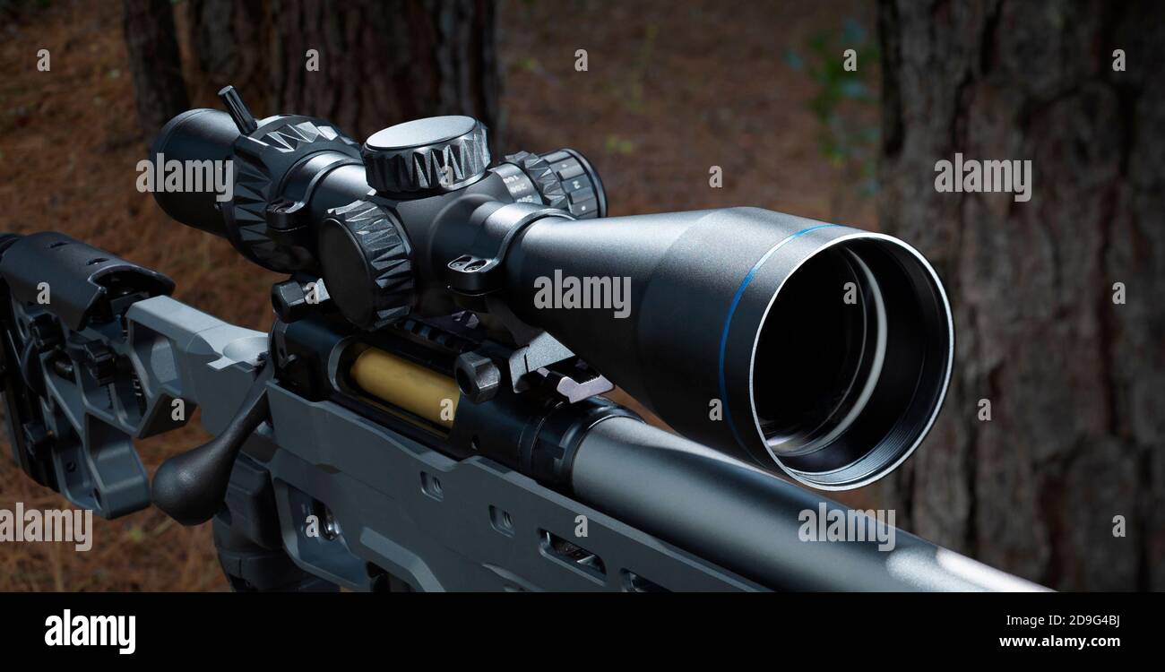 Rifle scope on a bolt action rifle in a forest Stock Photo - Alamy