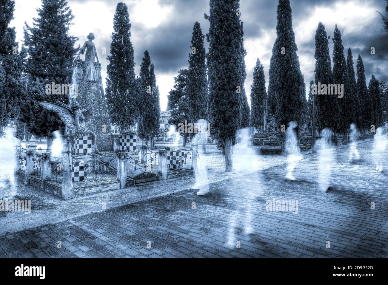 Cemetery and ghosts walking among the tombs.Concept of life after death ...