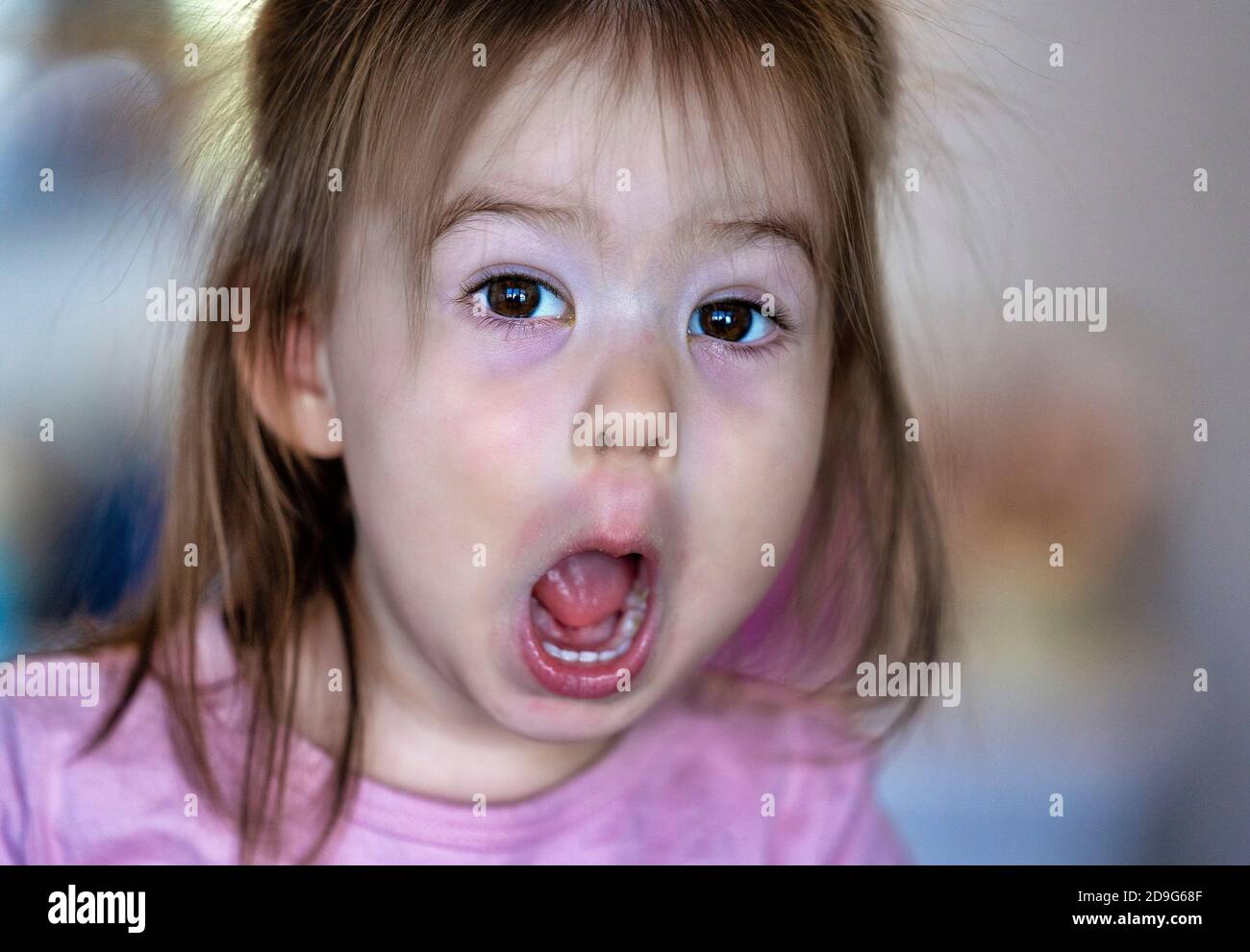 Two year old girl lets out a screech Stock Photo - Alamy