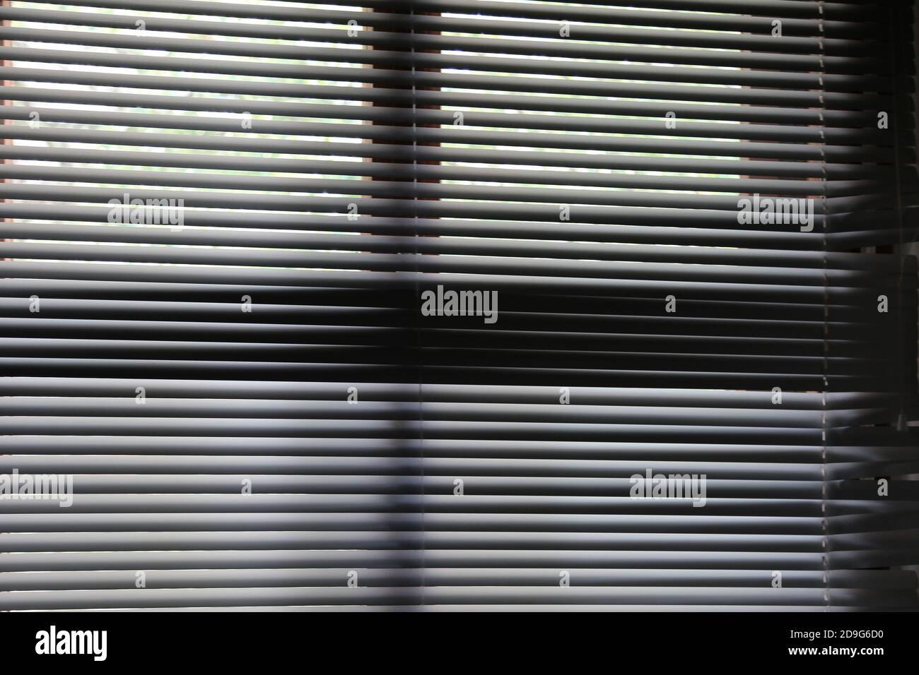 Venetian blinds with visible light. Sun shining through window blinds ...
