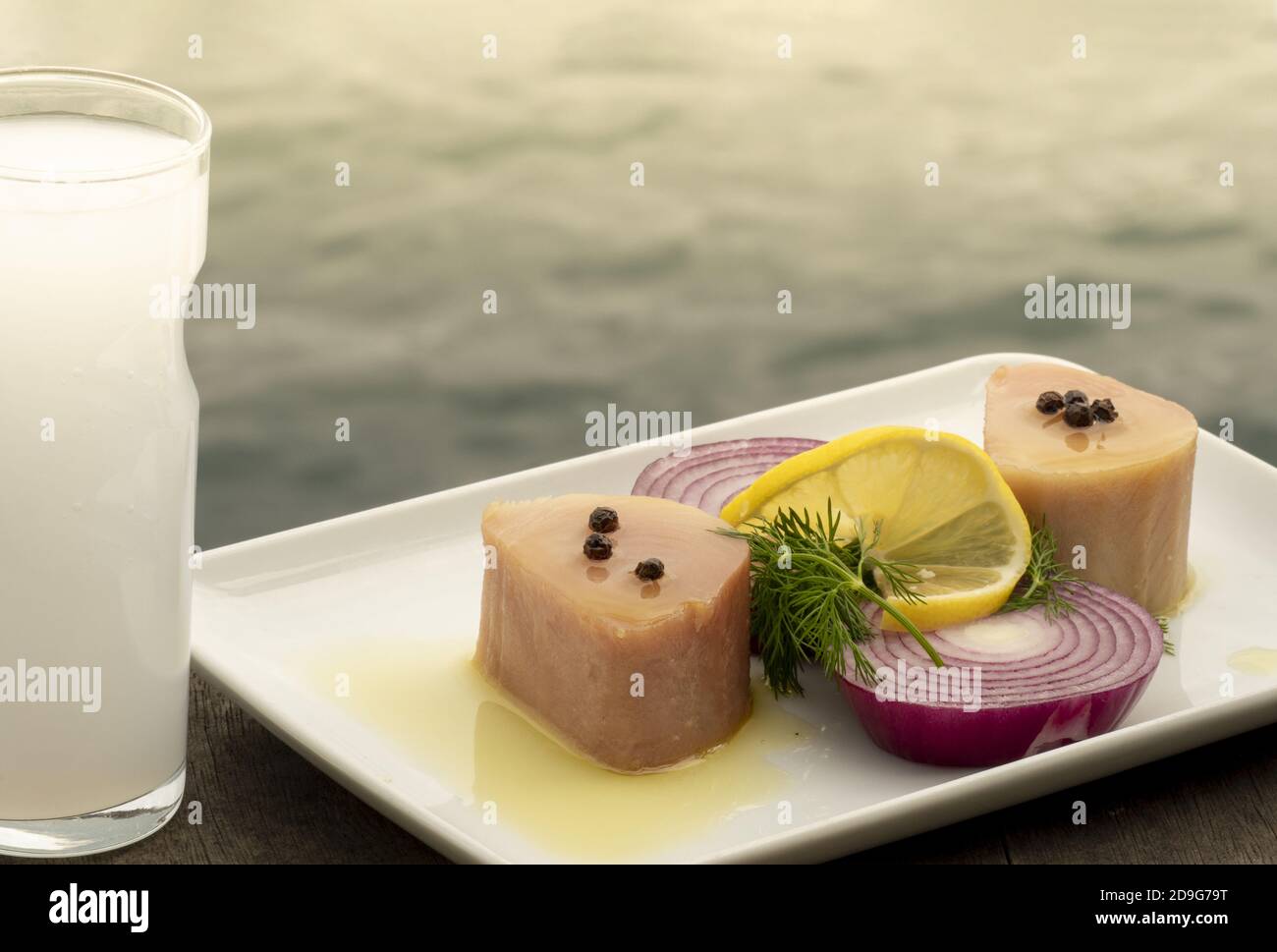 Closeup traditional Turkish appetizer Lakerda with tuna, lemons and a ...