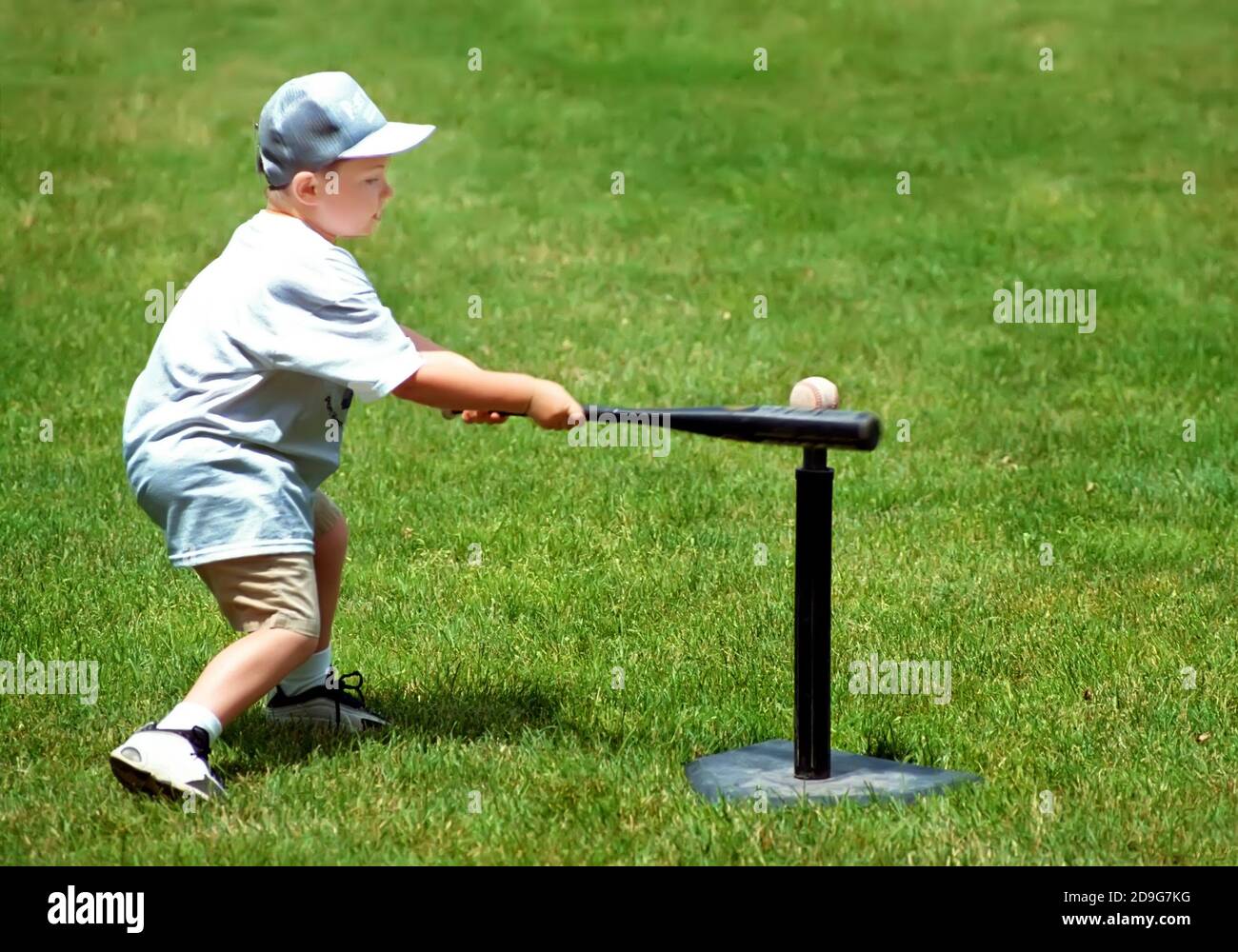 4 and 5 year old boys and girls learn how to hit a ball off of a tee ...